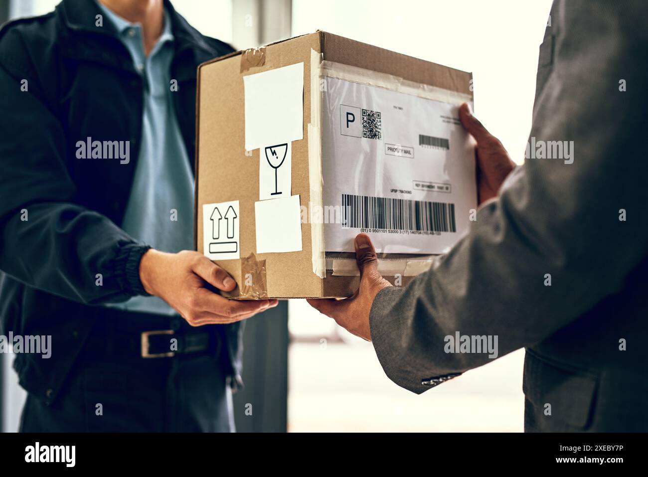Delivery man, hands and giving box at front door with stock, inventory ...