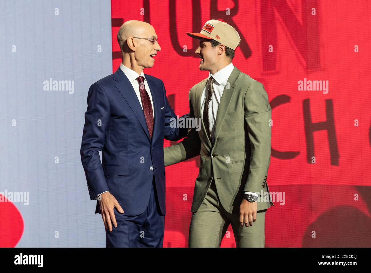 New York, USA. 26th June, 2024. Commissioner Adam Silver shakes hands ...