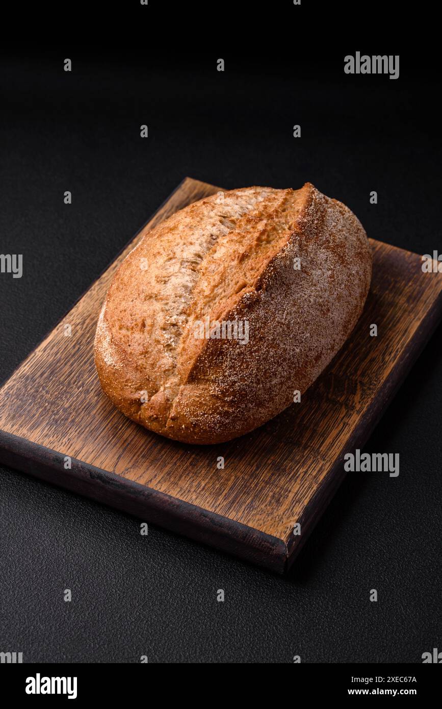 Delicious fresh baked crispy loaf of bread with seeds and grains Stock ...