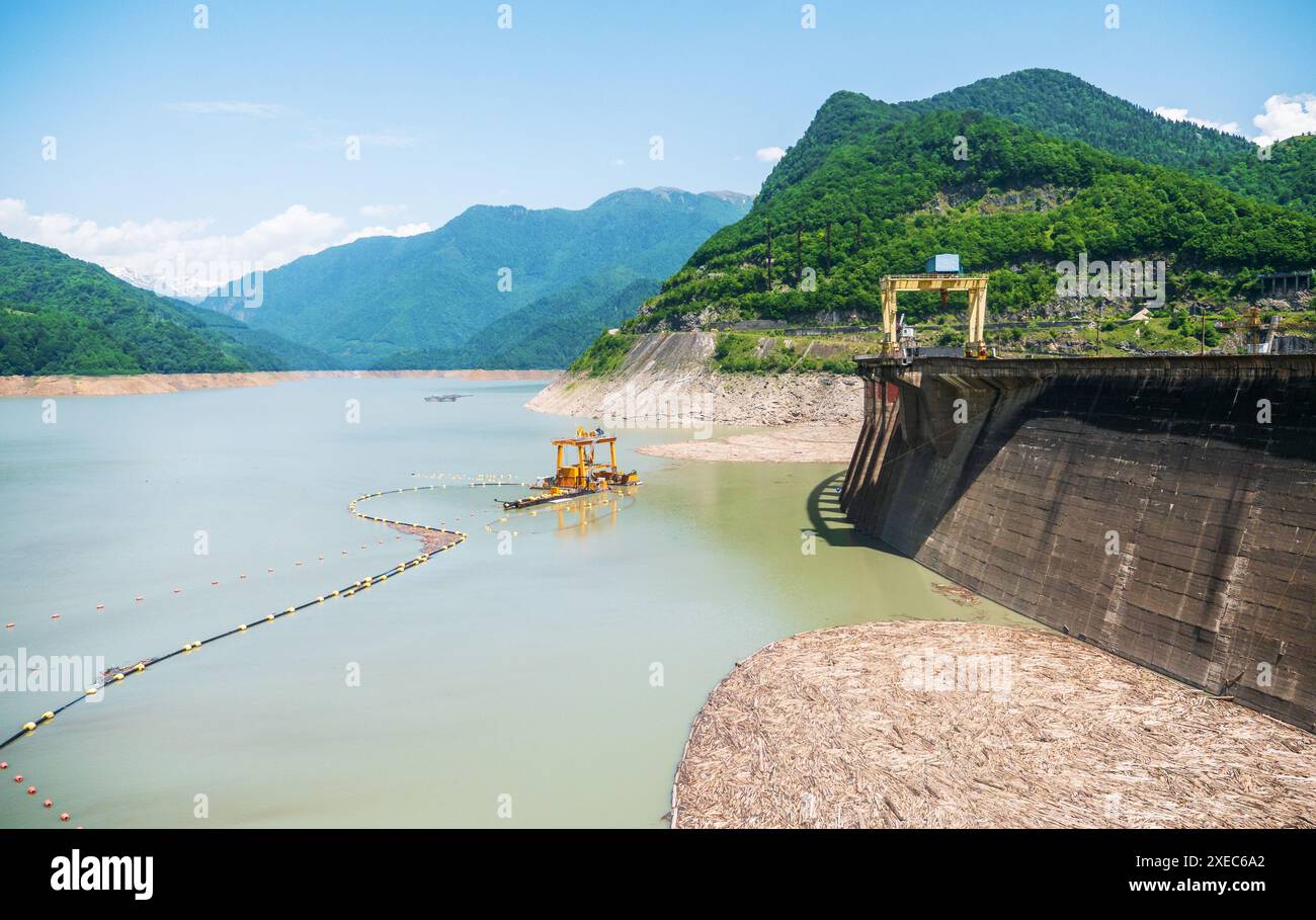 Enguri dam with operational crane and floating barrier system, set ...