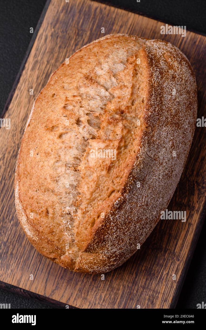 Delicious fresh baked crispy loaf of bread with seeds and grains Stock ...