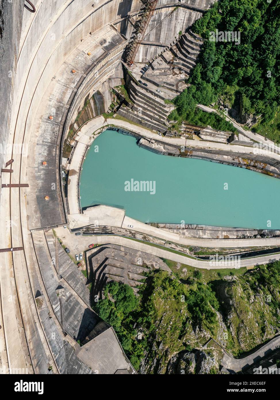 Aerial view of Enguri dam, unique curvature and emerald water reservoir ...