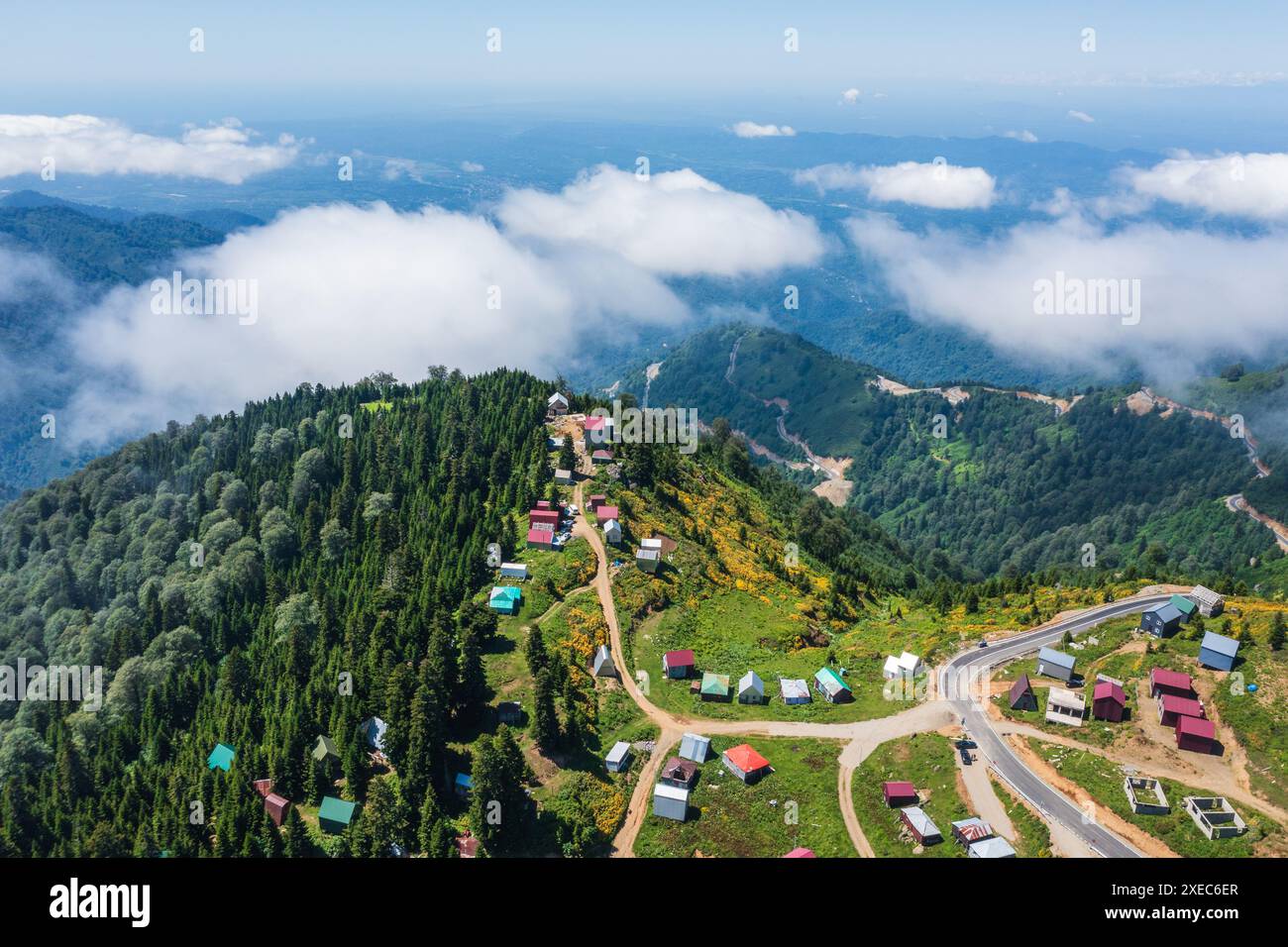 Drone aerial view of Gomismta, with houses nestled in mountains ...