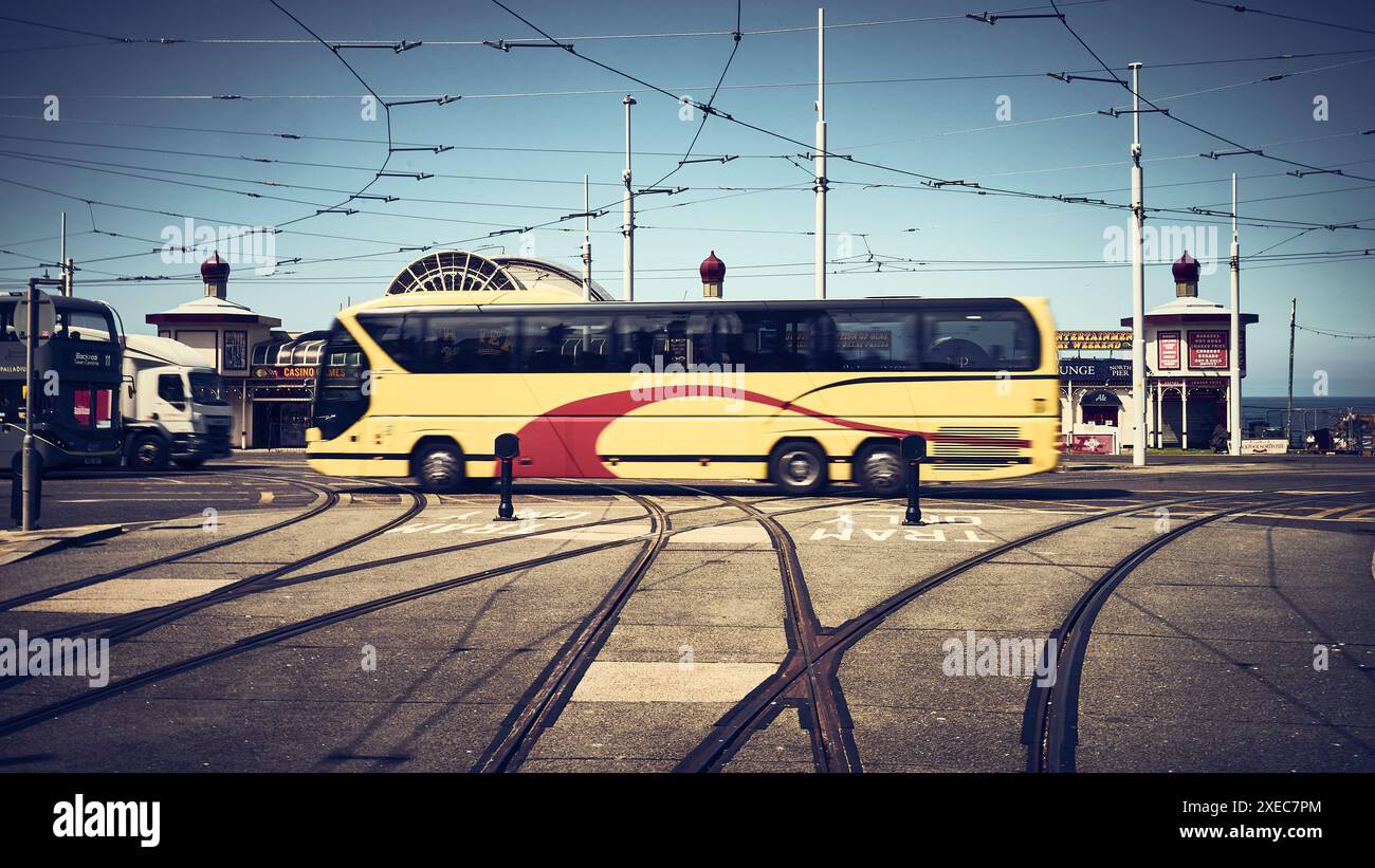 Bus crossing over tram lines on Blackpool seafront Stock Photo - Alamy