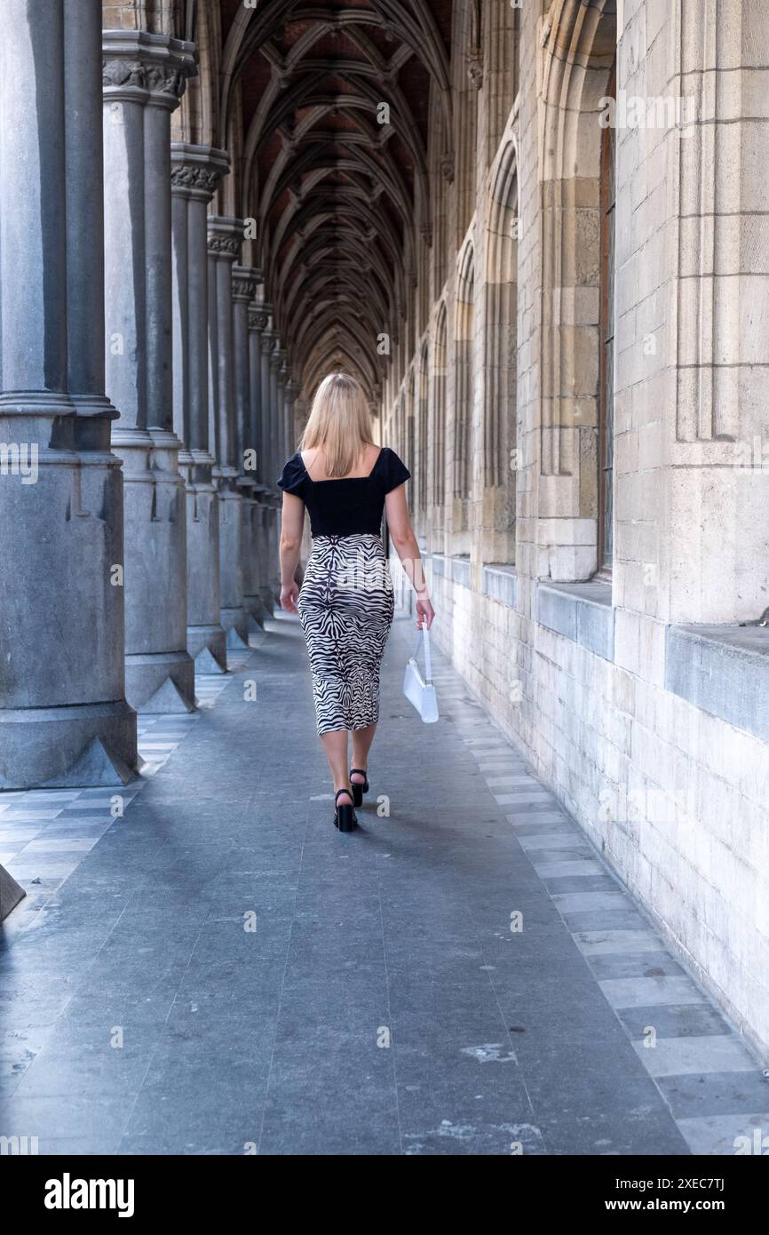 Woman walk through stone hi-res stock photography and images - Alamy