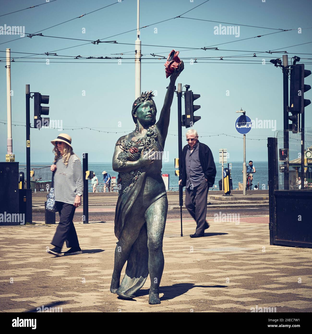 People walking past the Mermaid statue on Talbot Square,Blackpool,UK ...
