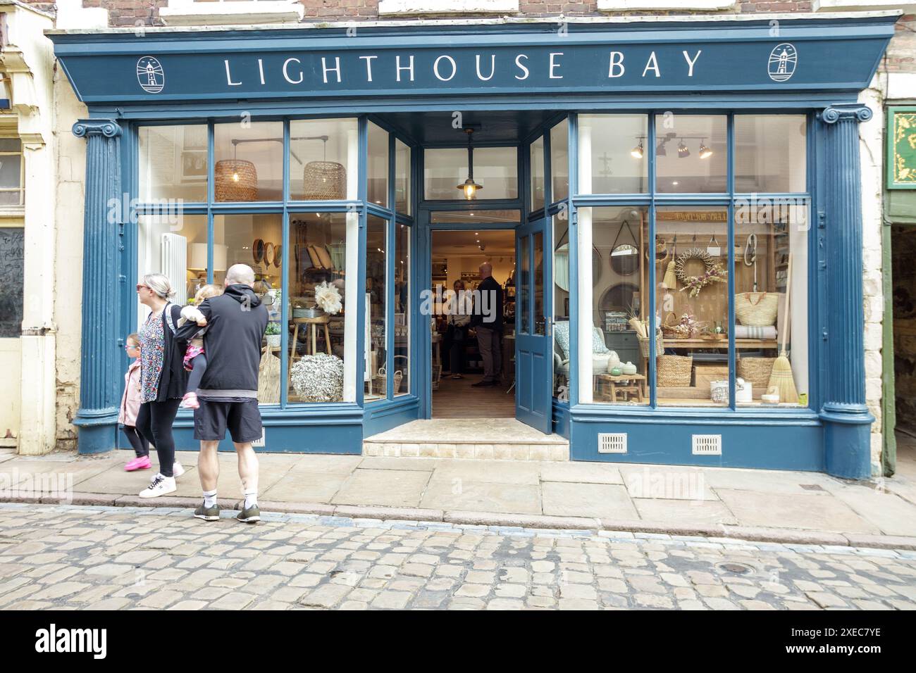Local business shop front in Whitby, North Yorkshire on a busy Bank ...