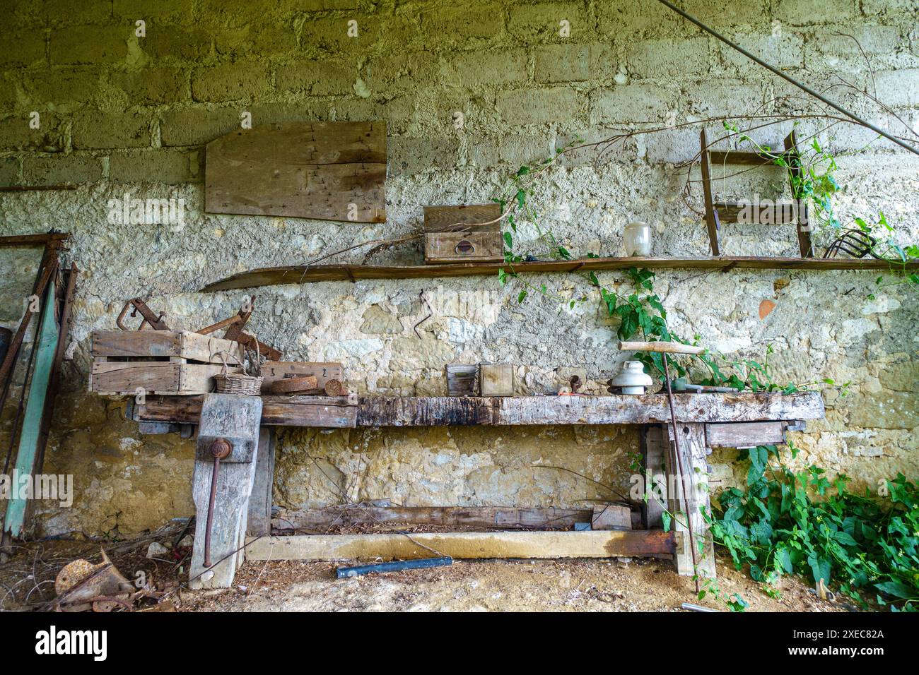 Rustic and long forgotten tools rest in an open air bran structure of ...
