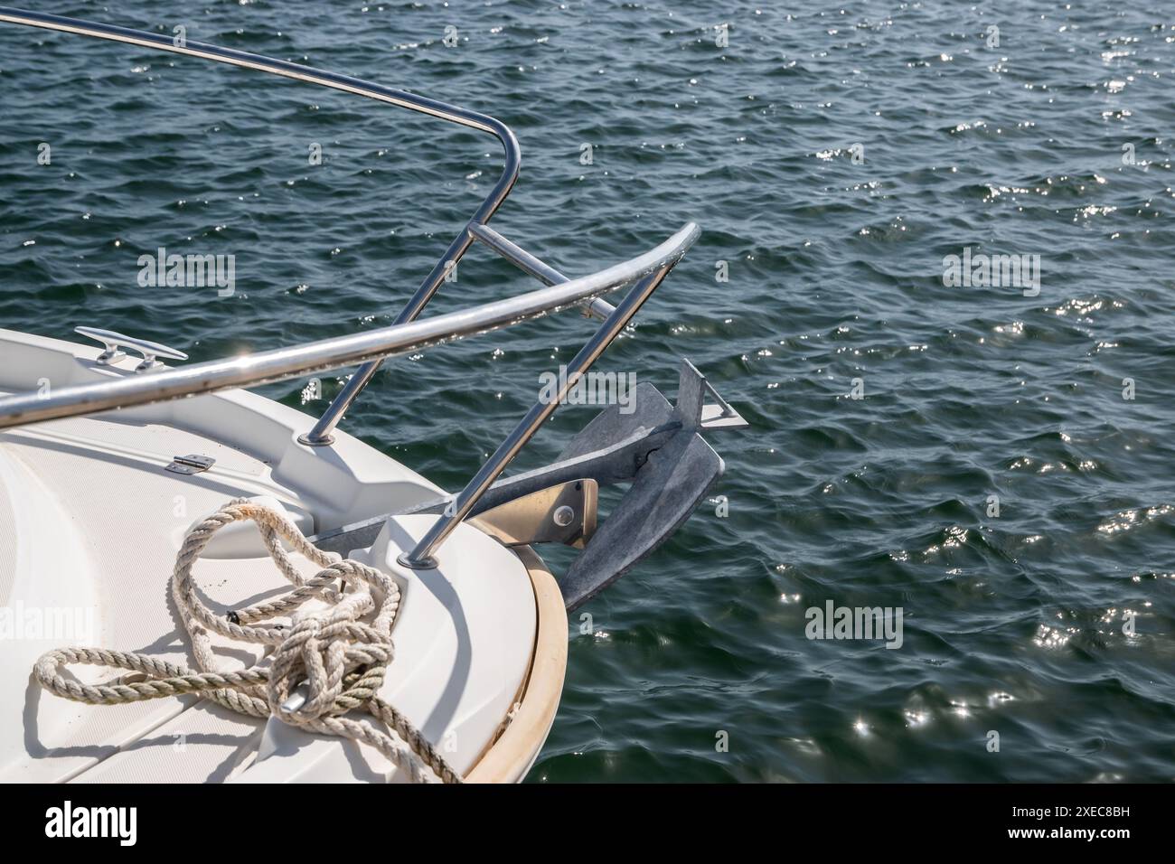 Sailing boat bow with mantus anchor on sea waters background Stock ...