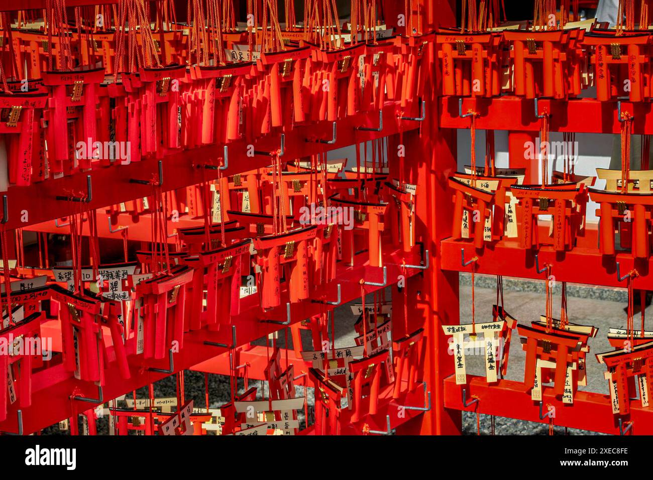 Red offerings and wishes at the Fushimi Inari shrine, Japan Stock Photo ...