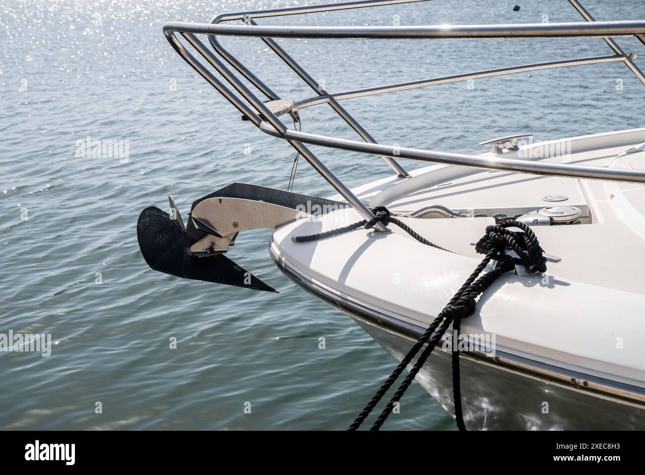Sailing boat bow with mantus anchor on sea waters background Stock ...