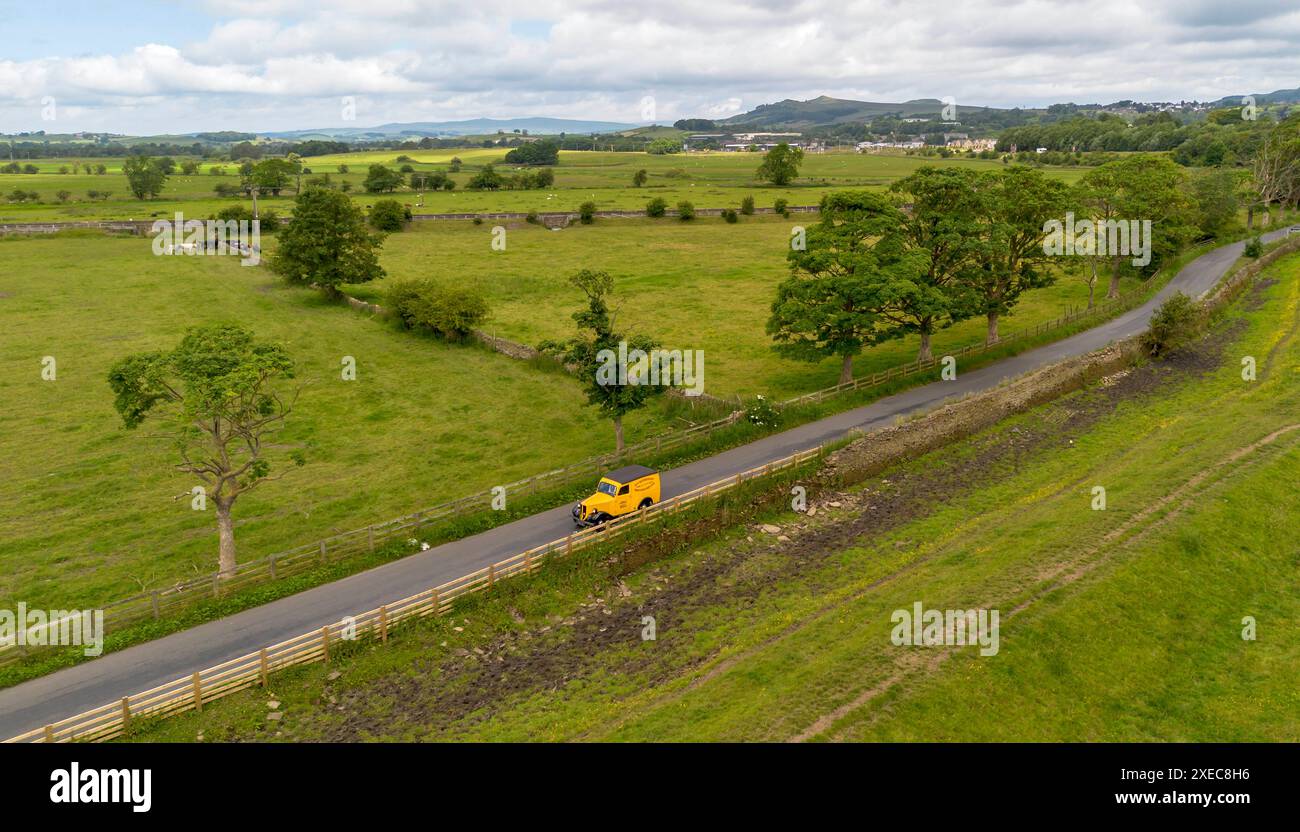 EDITORIAL USE ONLY Mark Thompson drives a vintage Morrisons delivery ...