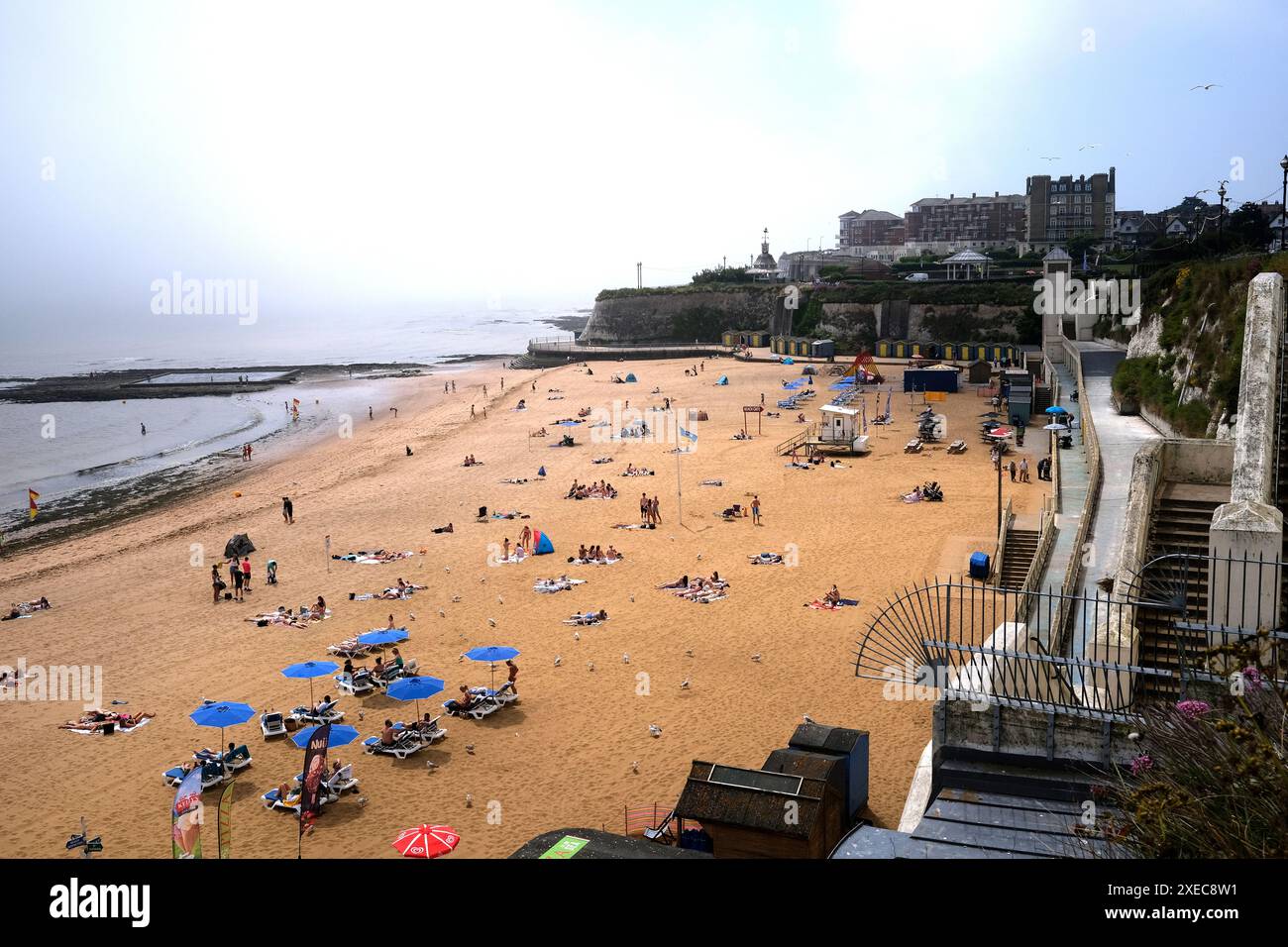 broadstairs seaside town with tourists relaxing on sandy beach,sunny ...