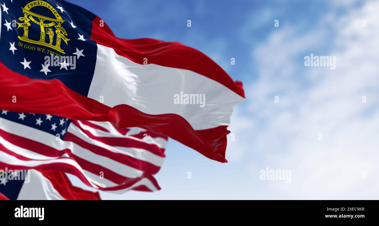 Flags of Georgia and United States waving in the wind on a clear day ...