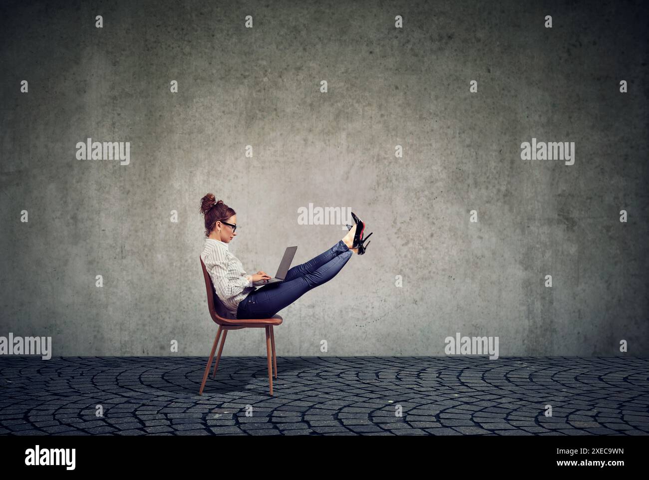 Woman legs up chair hi-res stock photography and images - Alamy