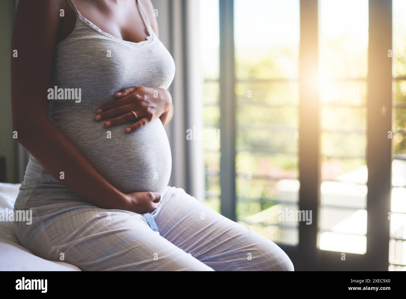 Woman, pregnant and hands on stomach for growth, bonding and maternal ...