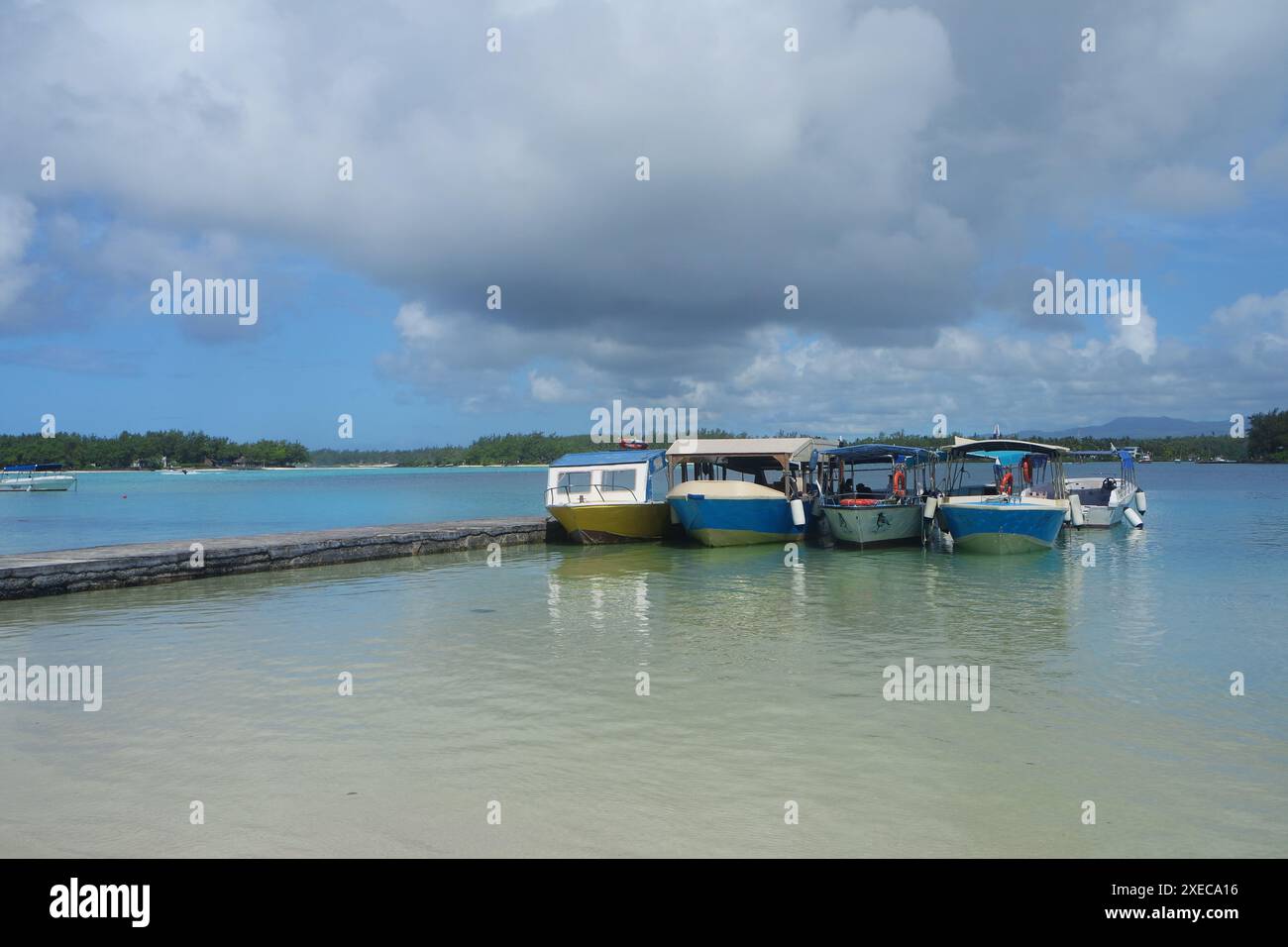 Tour boats in Blue Bay, Mauritius Stock Photo - Alamy