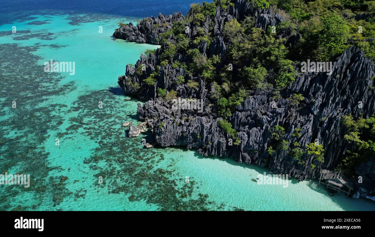 Tropical island with beach rocks coral reef Stock Photo - Alamy