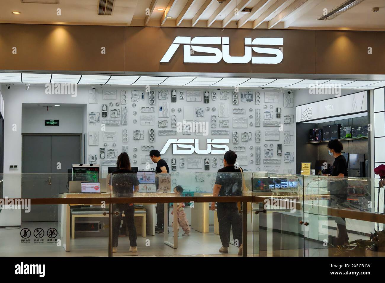 SHANGHAI, CHINA - JUNE 27, 2024 - Customers shop at an ASUS store in ...