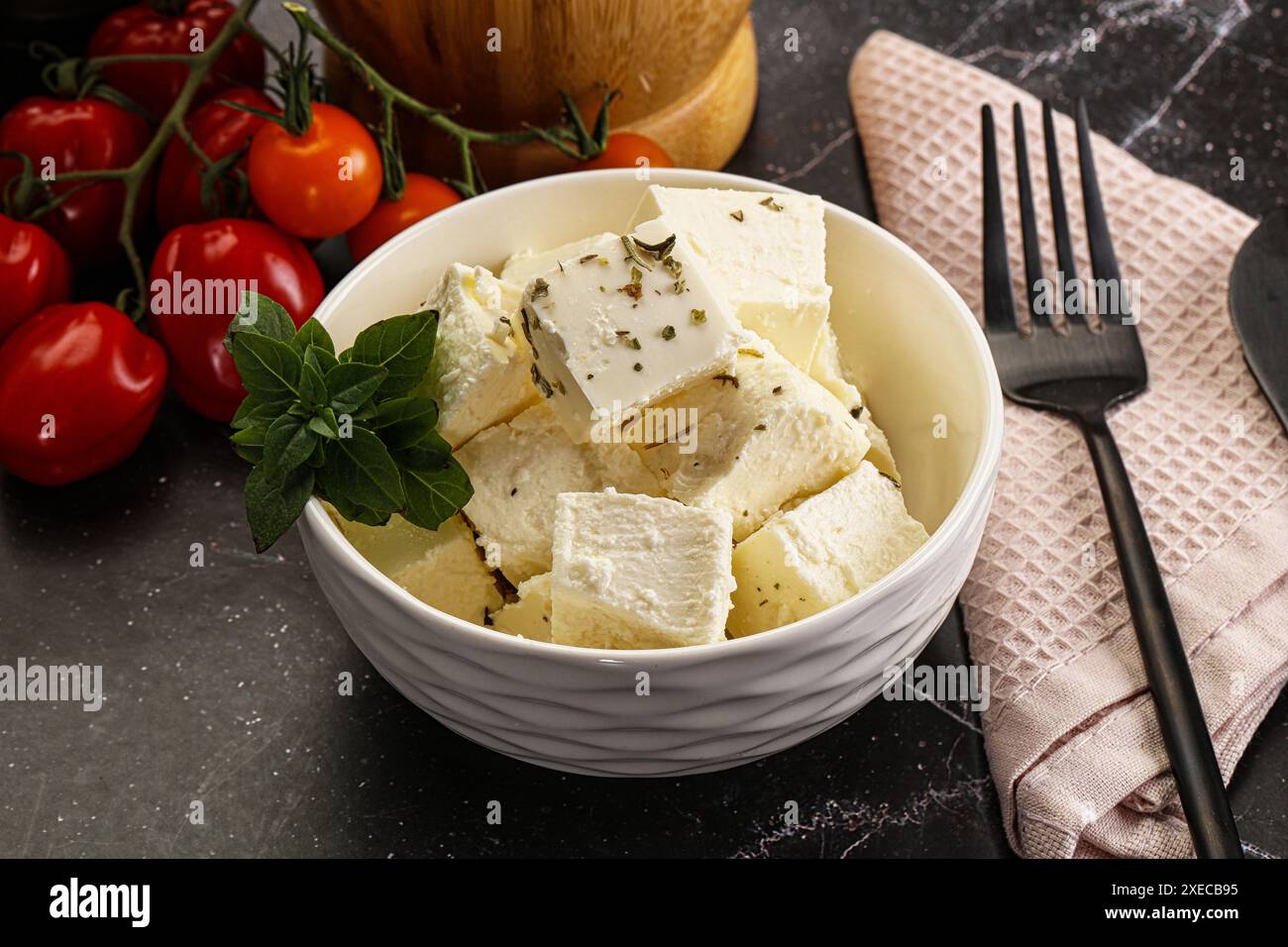 Greek traditional Feta cheese cubes with herbs and spices Stock Photo ...