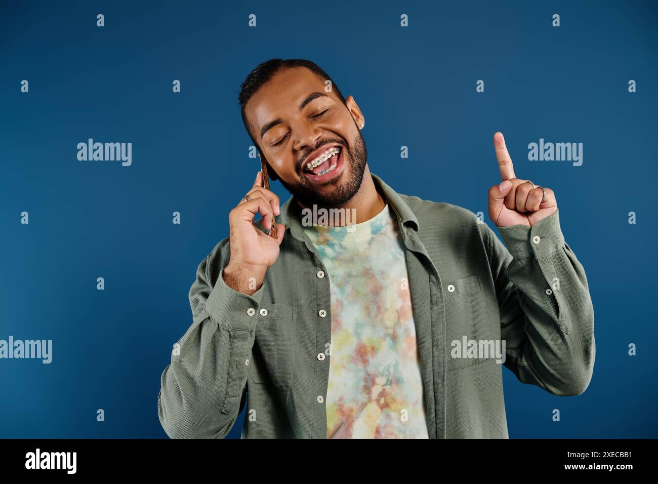Man holding cell phone ear hi-res stock photography and images - Alamy