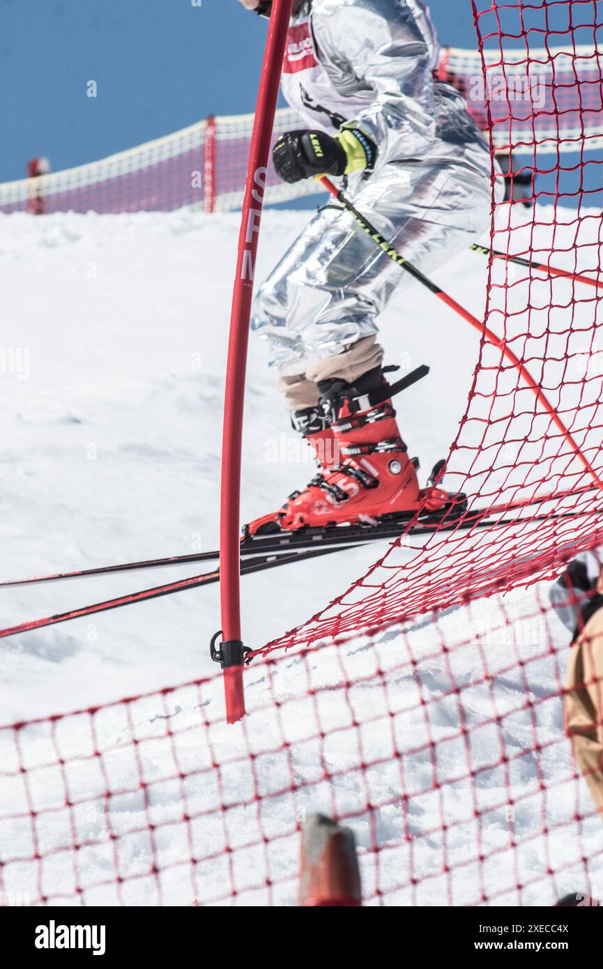 Making a jump while skiing Stock Photo - Alamy