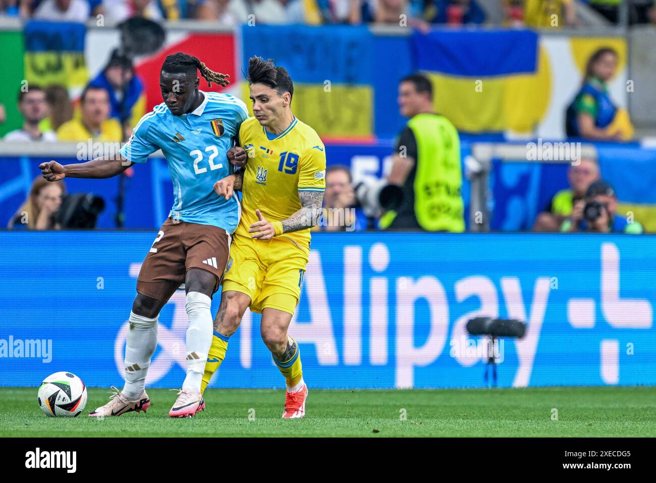 Jeremy Doku (22) of Belgium and Mykola Shaparenko (19) of Ukraine ...