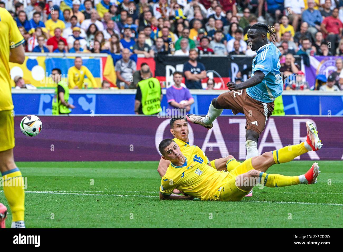 Jeremy Doku (22) of Belgium , Vitaliy Mykolenko (16) of Ukraine during ...