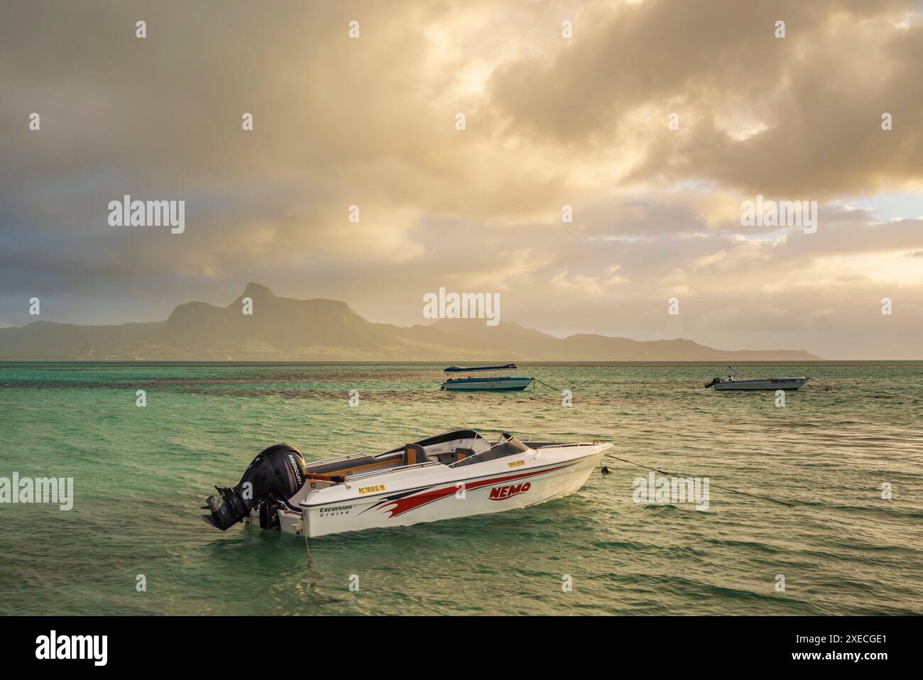 Boats on a lagoon near Point Jerome at sunrise, Preskil Island ...