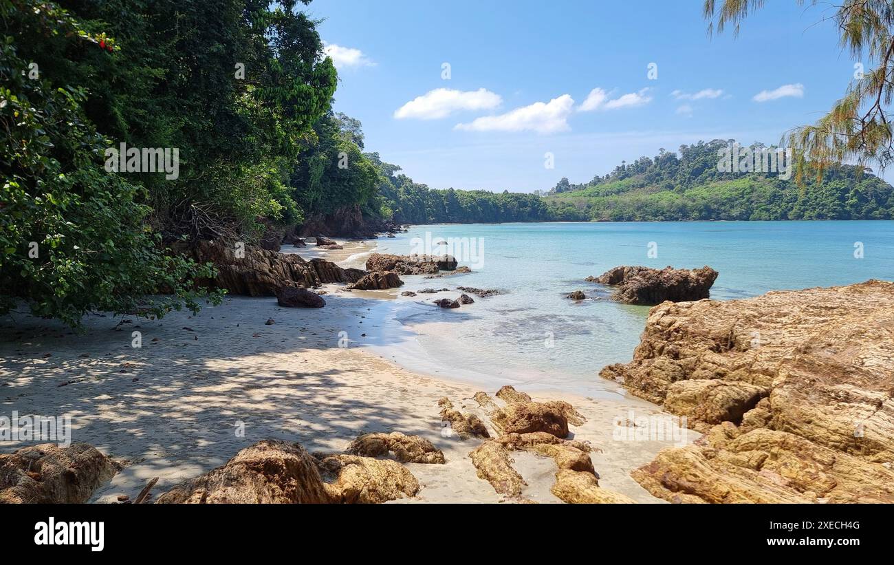 A peaceful beach scene where the waves gently caress the shore ...