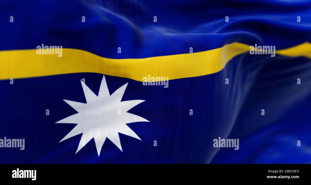 Close-up of Nauru national flag waving in the wind. Island country in ...