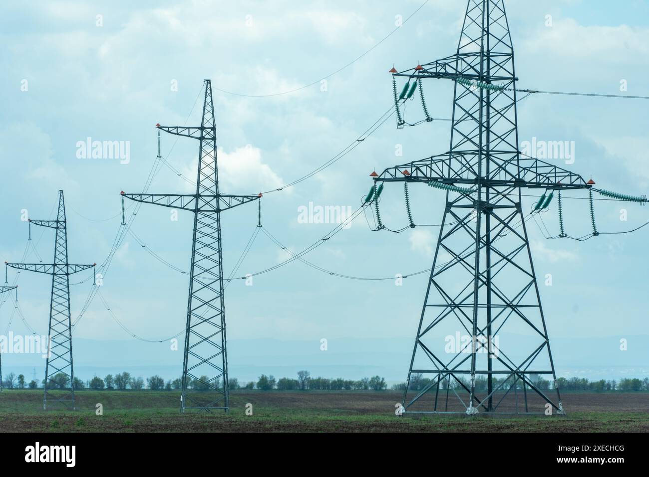 High voltage towers with sky background. Power line support with wires ...
