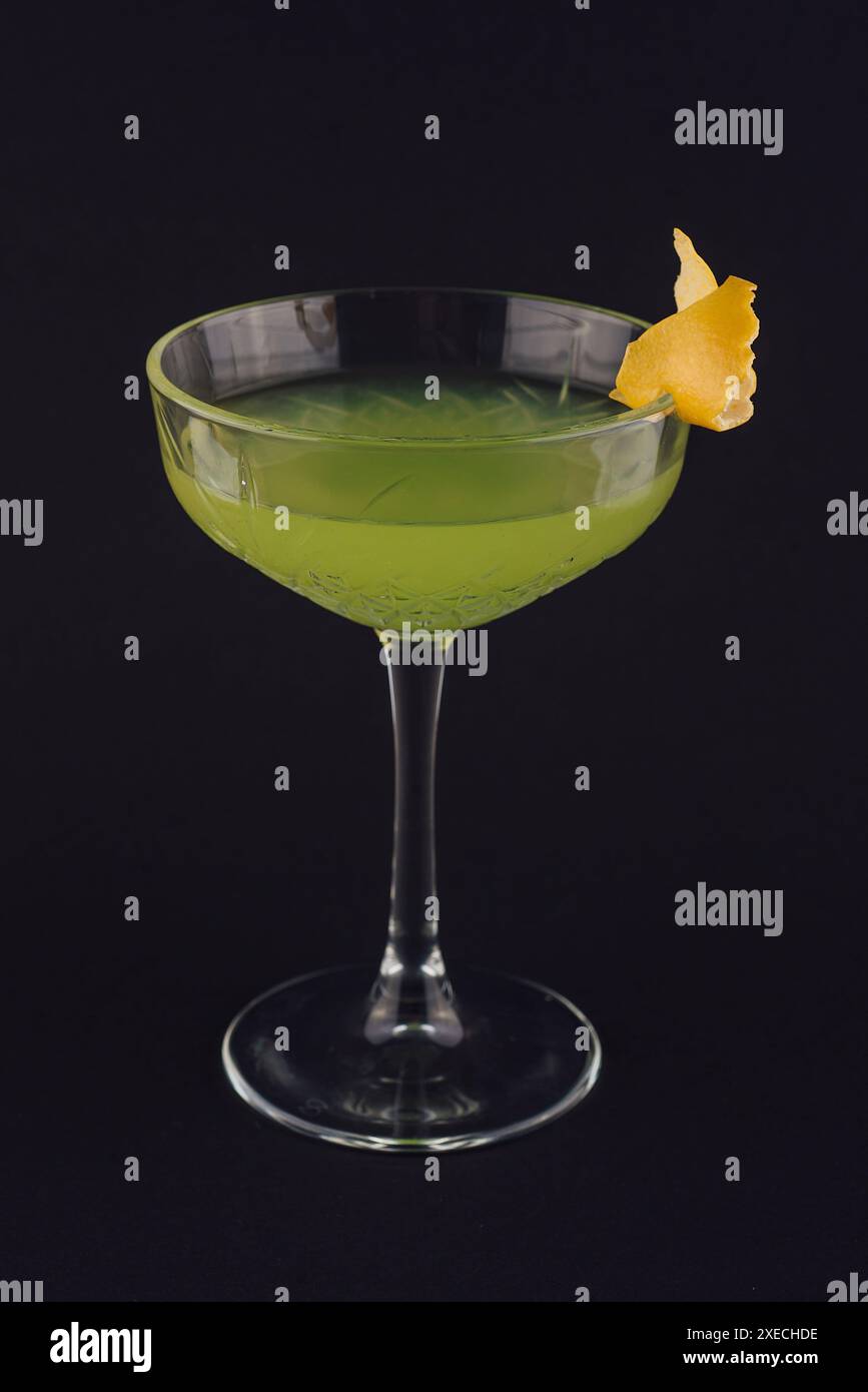 Apple martini coctail isolated on black background Stock Photo - Alamy