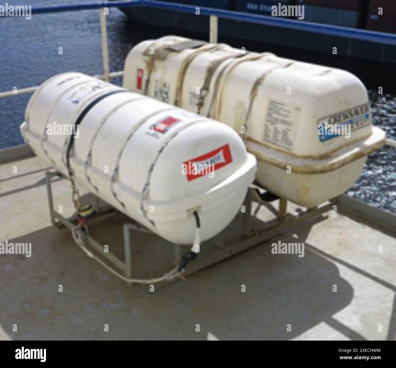 Photo of two encapsulated liferafts in a rack on the El Yunque. The ...