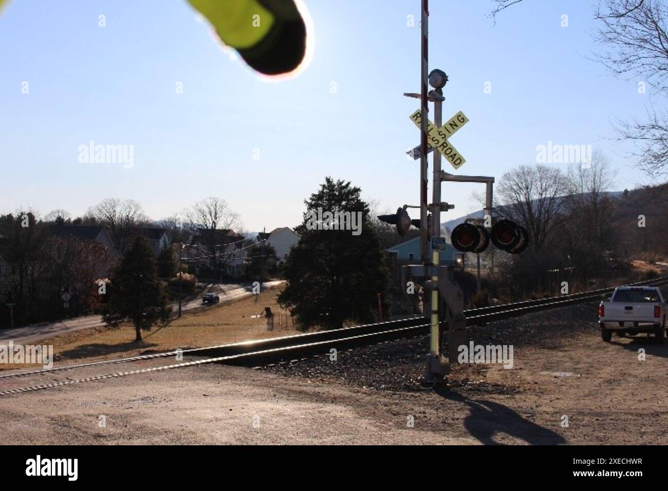 Southbound view of highway–rail grade crossing showing active warning ...