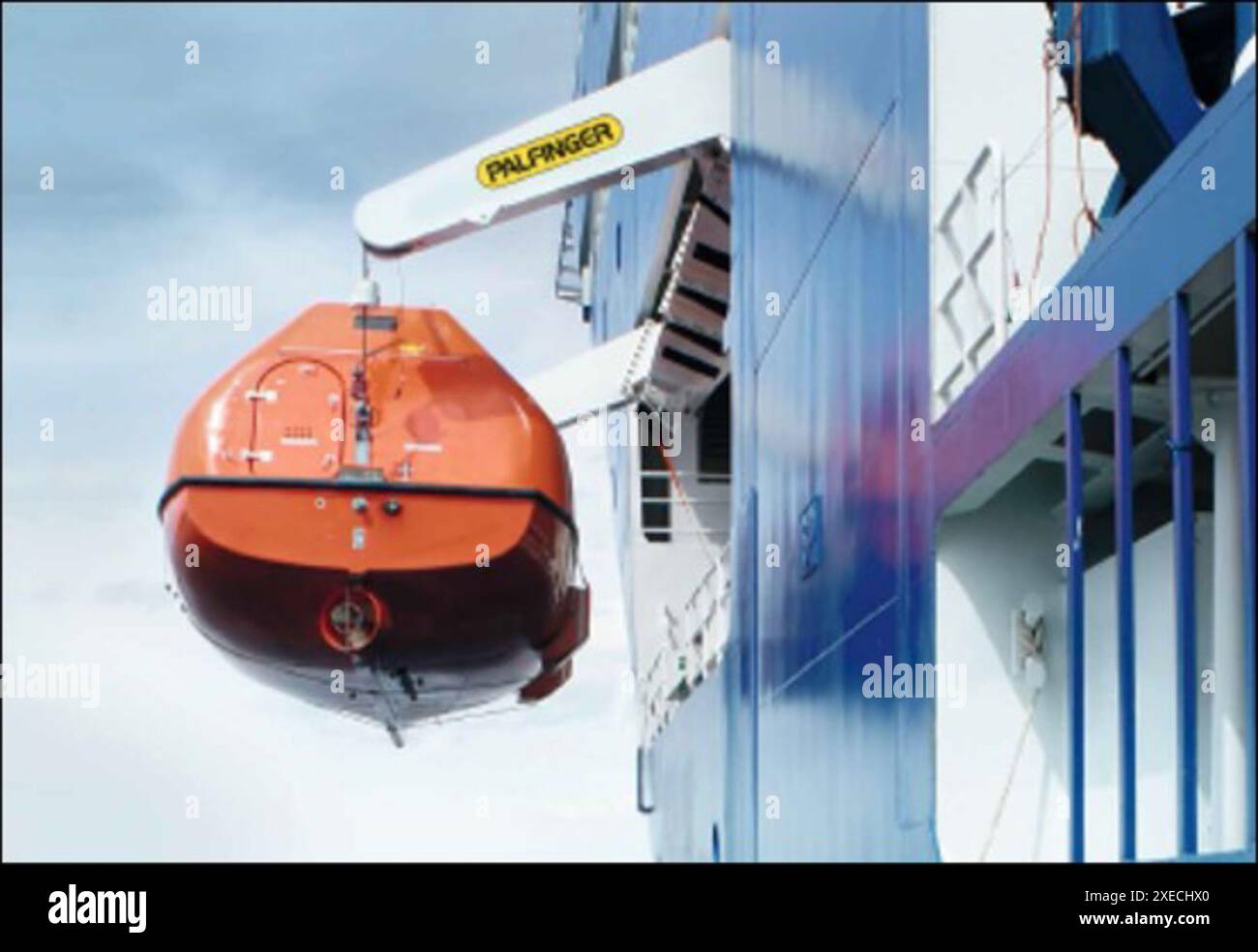 Photo of the stern of a side-launched enclosed lifeboat as it hangs ...