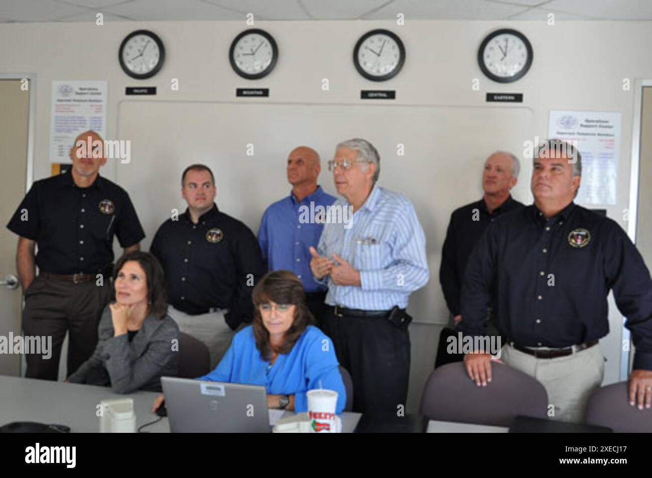Chairman Hersman and NTSB staff view a demonstration of the CADEC bus ...