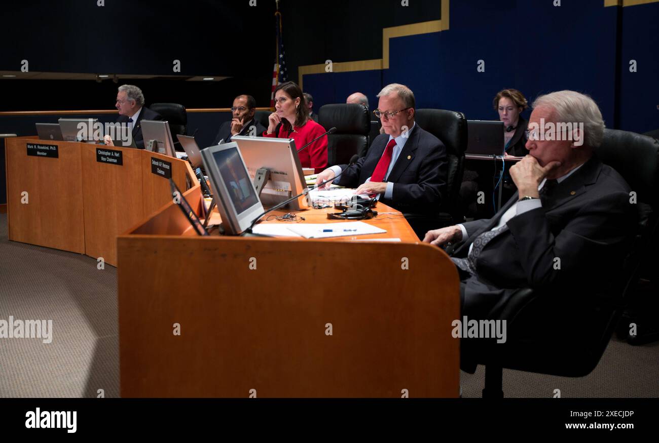 NTSB Board Members listen to testimony during the investigative hearing ...