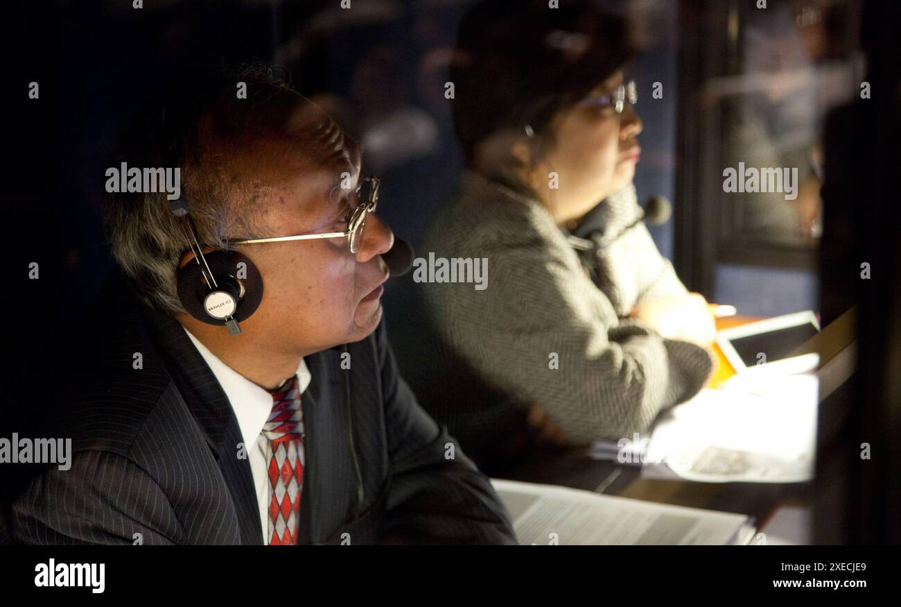 Language interpreters provide translation of testimony during the 787 ...