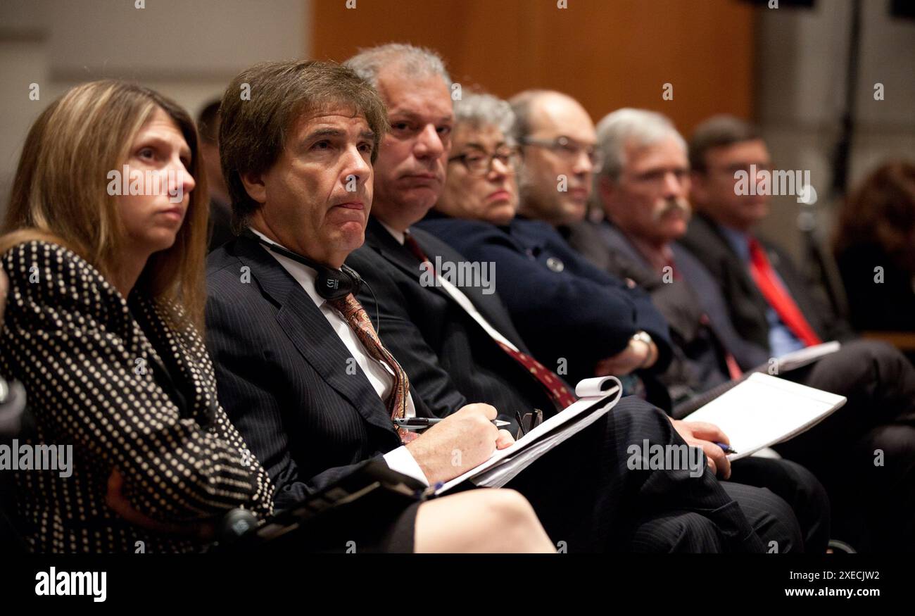 Audience members listen to the panel discussions during 787 battery ...