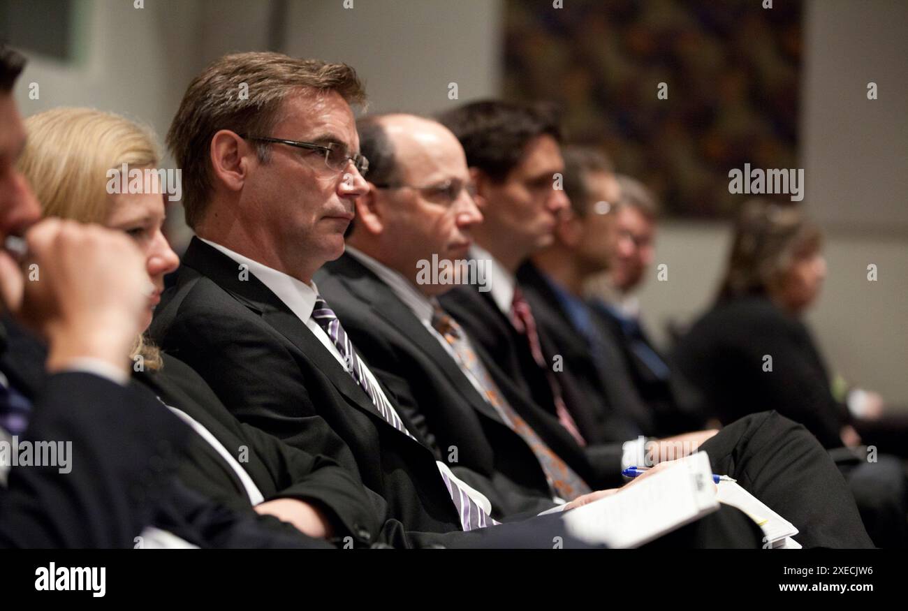 Audience members listen to the panel discussions during 787 battery ...