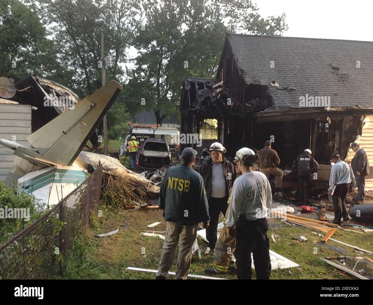 NTSB senior air safety investigator Bob Gretz with emergency responders ...