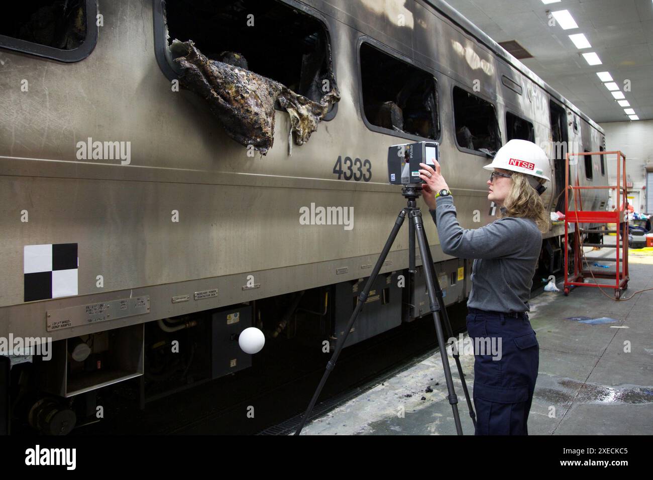NTSB investigator Kristin Poland sets-up 3D Laser Scanner to create a ...