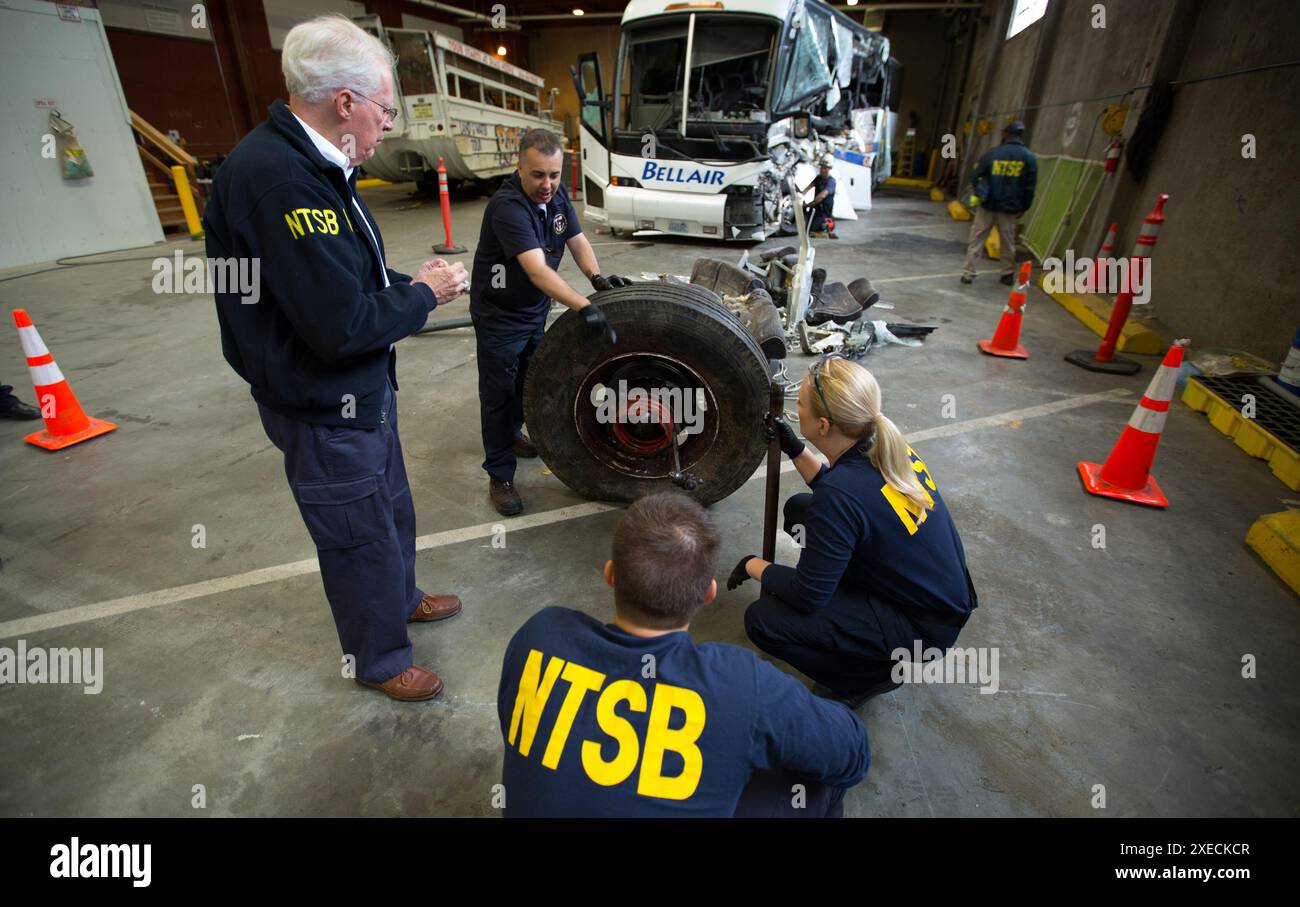 NTSB investigative team examines the wheel of the DUKW vehicle involved ...