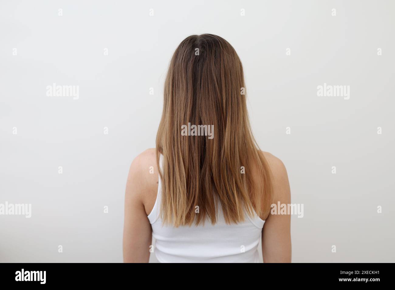 Rear view of woman with long but problematic hair, unhealthy, messy ...