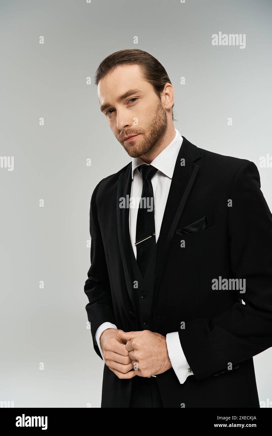 A charismatic, bearded businessman in a sharp suit and tie strikes a ...