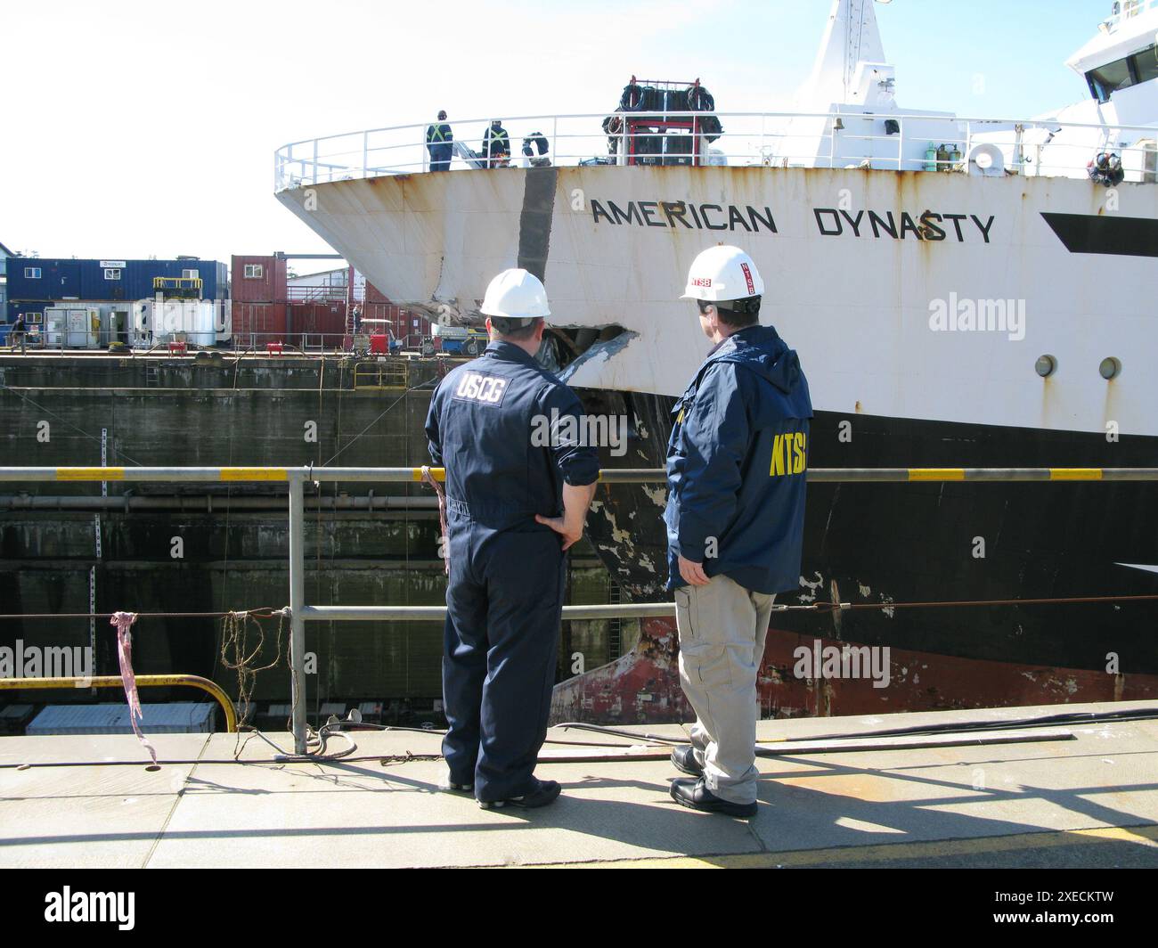 Senior Marine Investigator Morgan Turrell (R) and US Coast Guard CWO ...