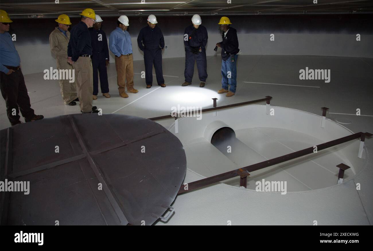 Acting Chairman Hart and staff examined the interior of a refined oil ...