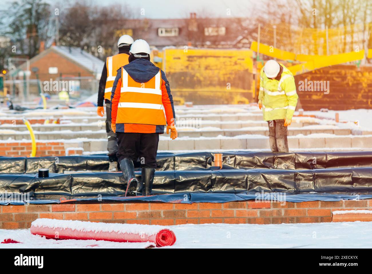 Waterproof installation at new house construction. Builders installing ...