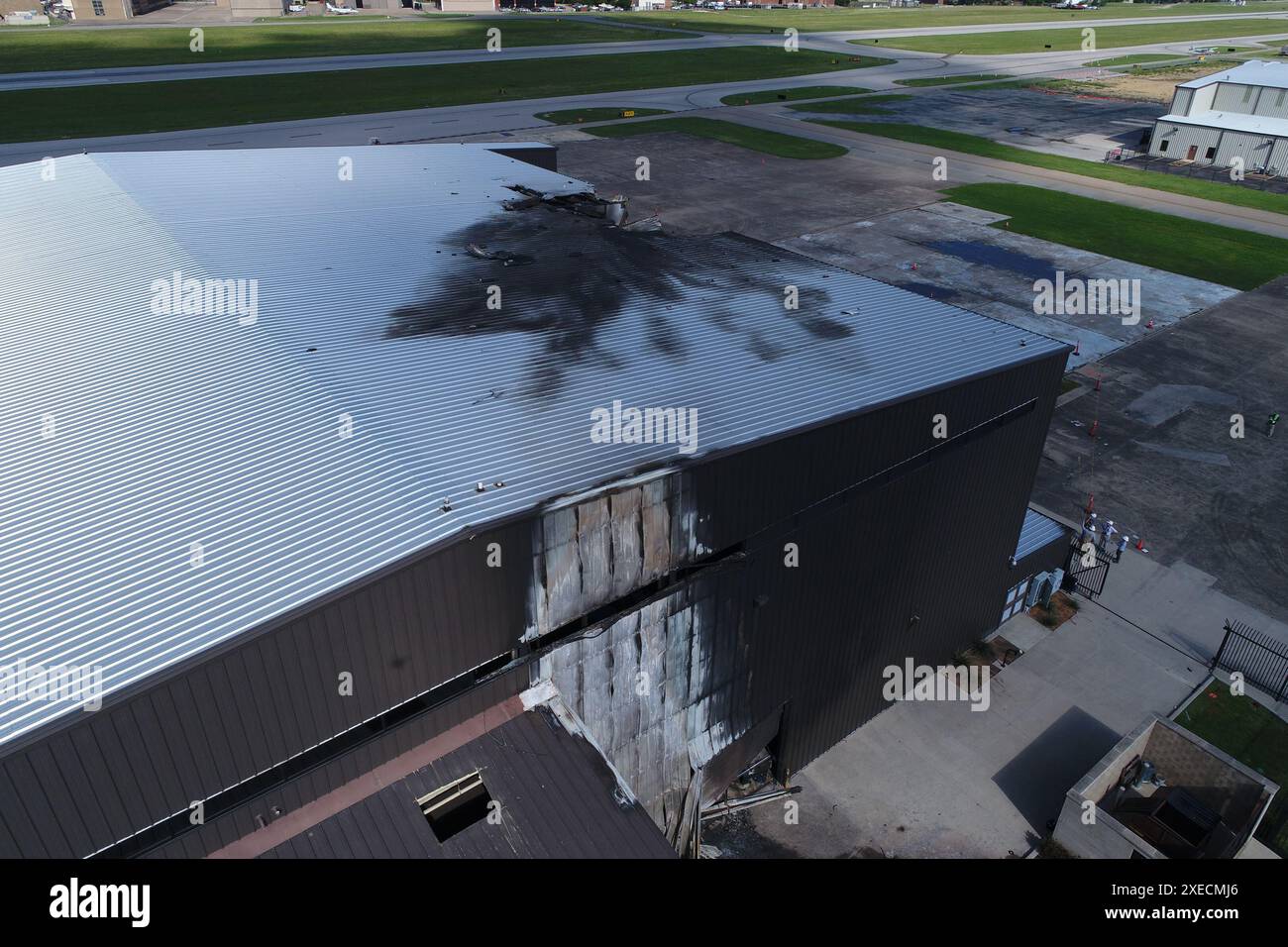 ADDISON, Texas (June 30, 2019) – Damage to a hangar at Addison Airport ...